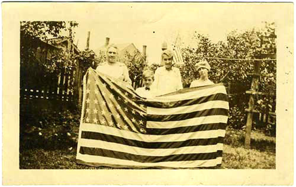 Family Holding Flag by [Photograph]: Very good condition Ephemera (1908 ...
