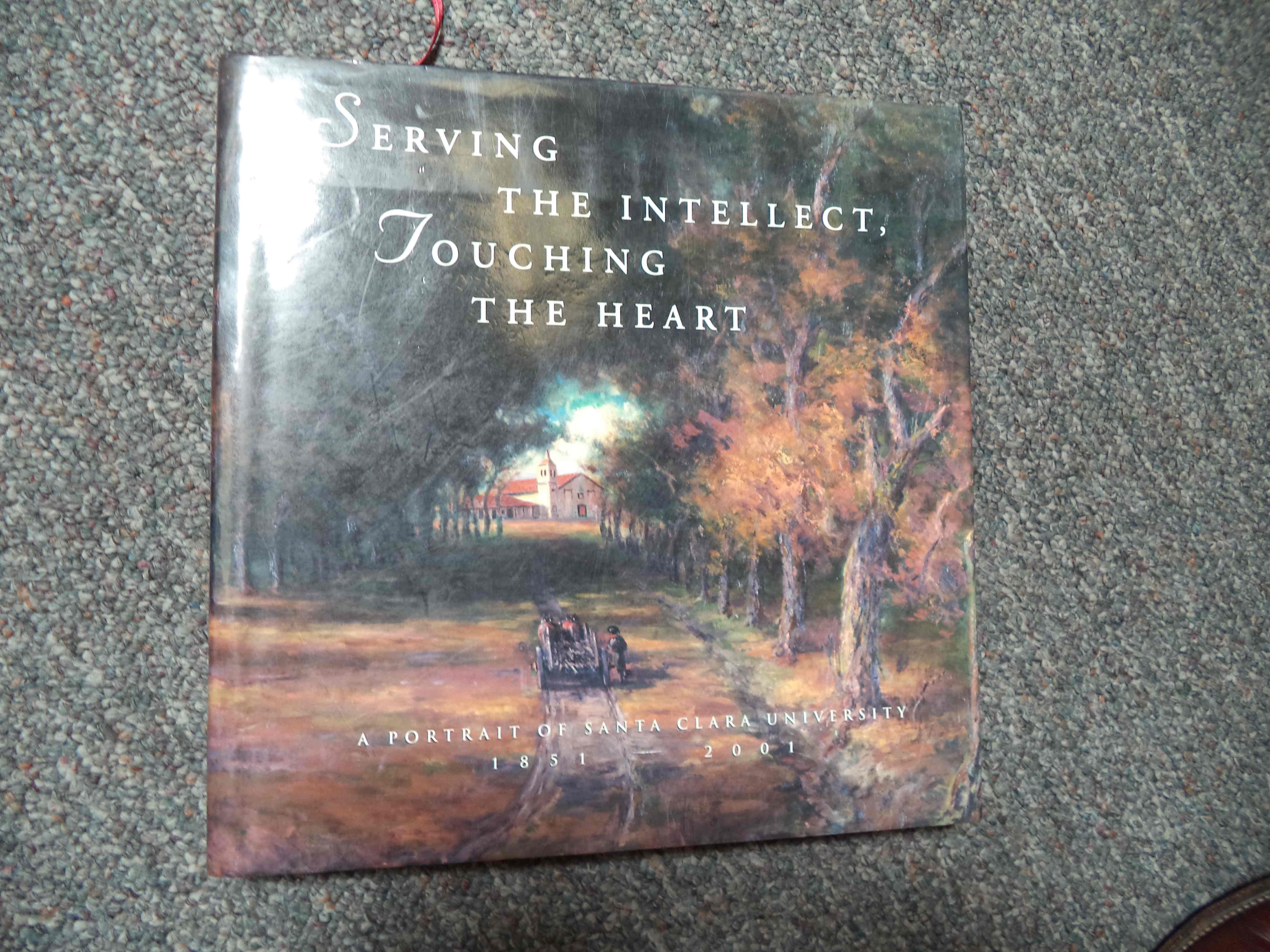 Serving the Intellect, Touching the Heart. Signed by both authors. A ...