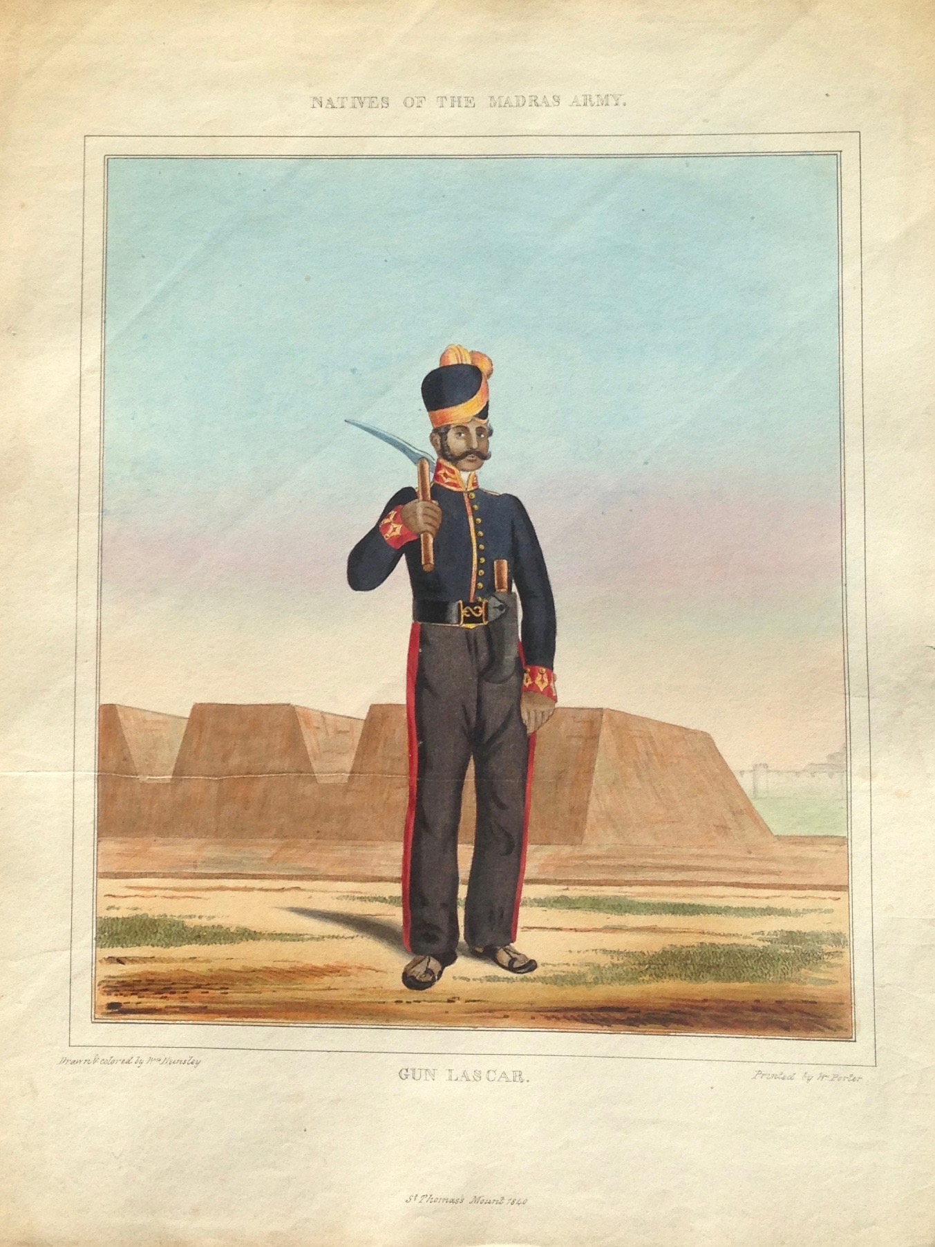 Gun Lascar, holding pick axe, gun batteries and fort in background by ...